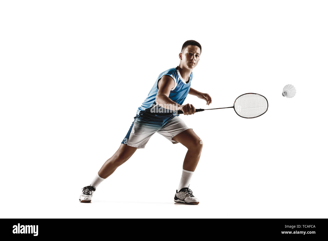Little boy playing badminton isolated on white studio background. Young ...