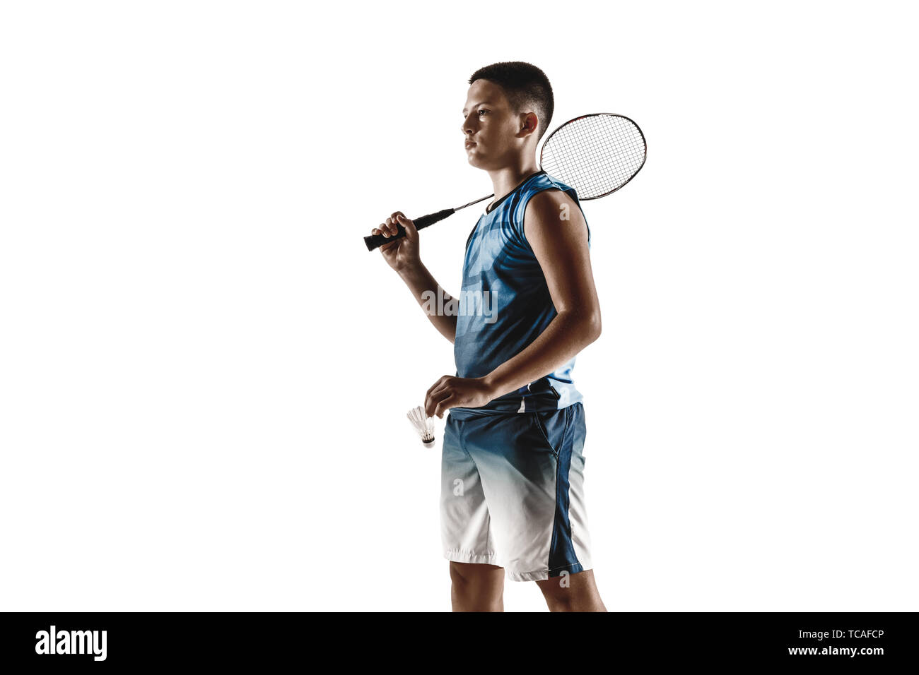 Little boy playing badminton isolated on white studio background. Young ...