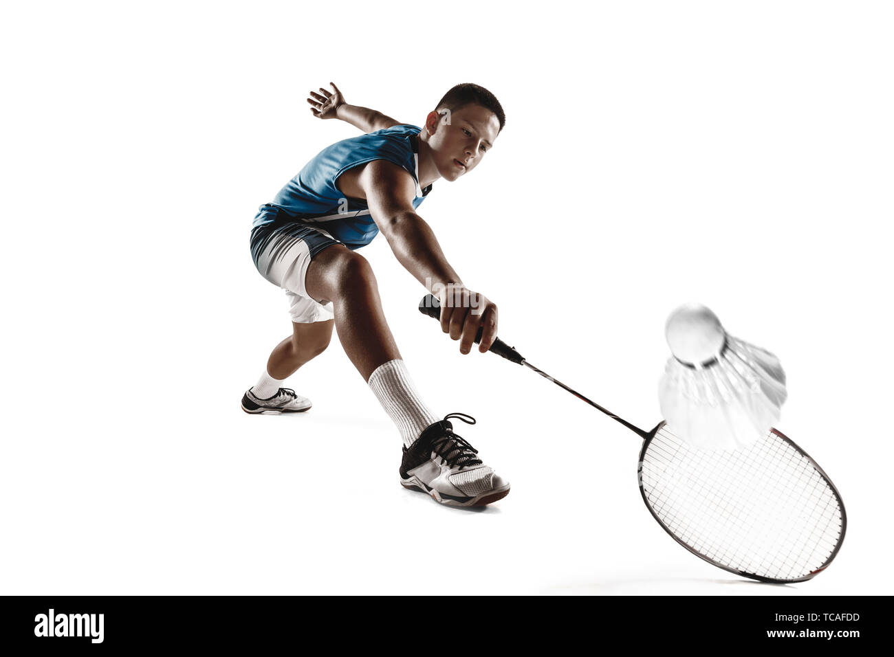 Little boy playing badminton isolated on white studio background. Young ...