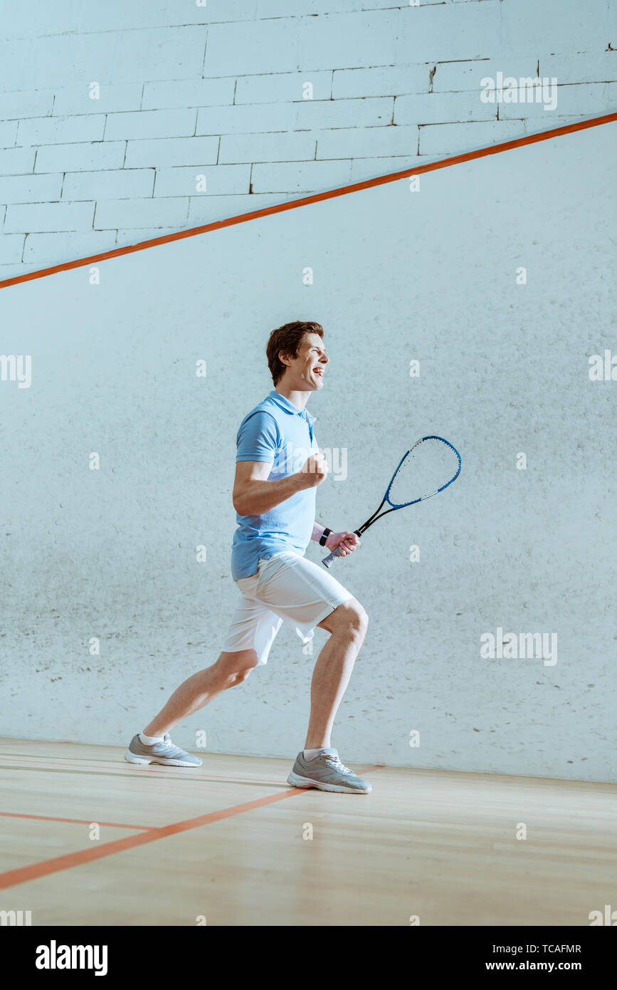 Full length view of happy squash player showing yes gesture Stock Photo ...