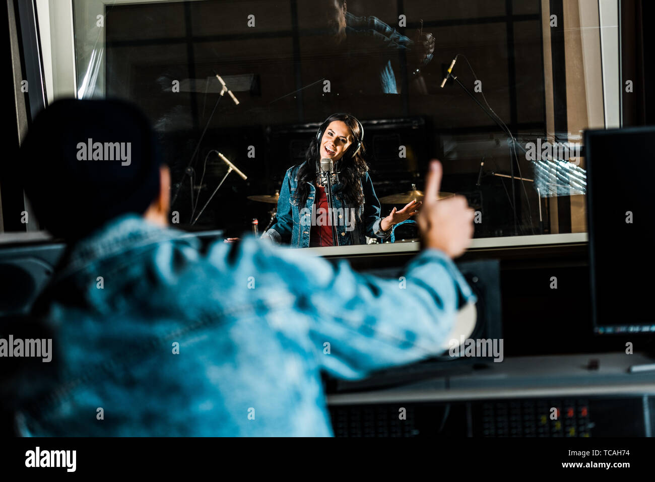 Sound producer showing thumb hi-res stock photography and images - Alamy
