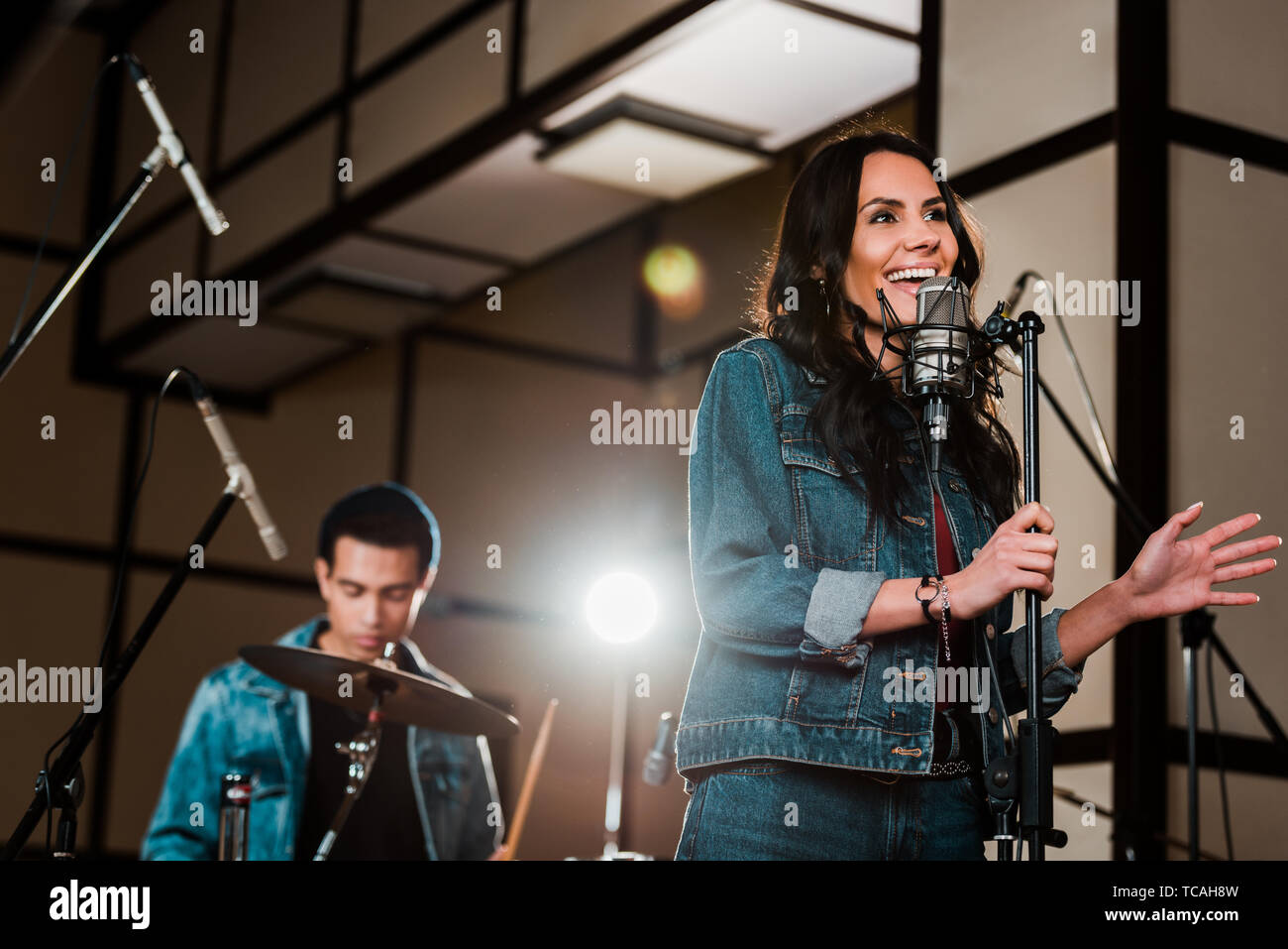 Handsome smiling singer recording hi-res stock photography and images ...