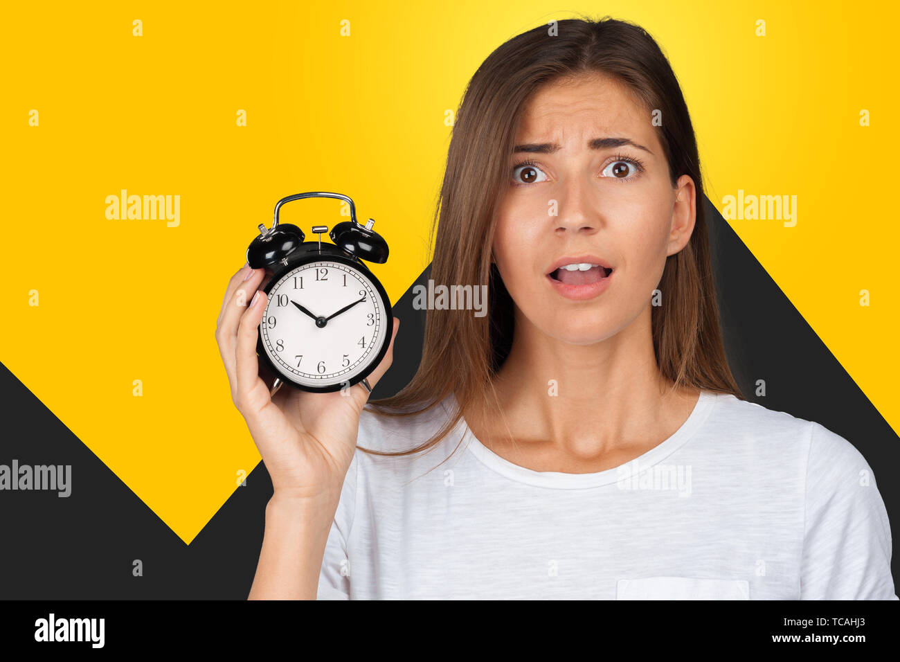 Business woman and alarm clock Stock Photo - Alamy
