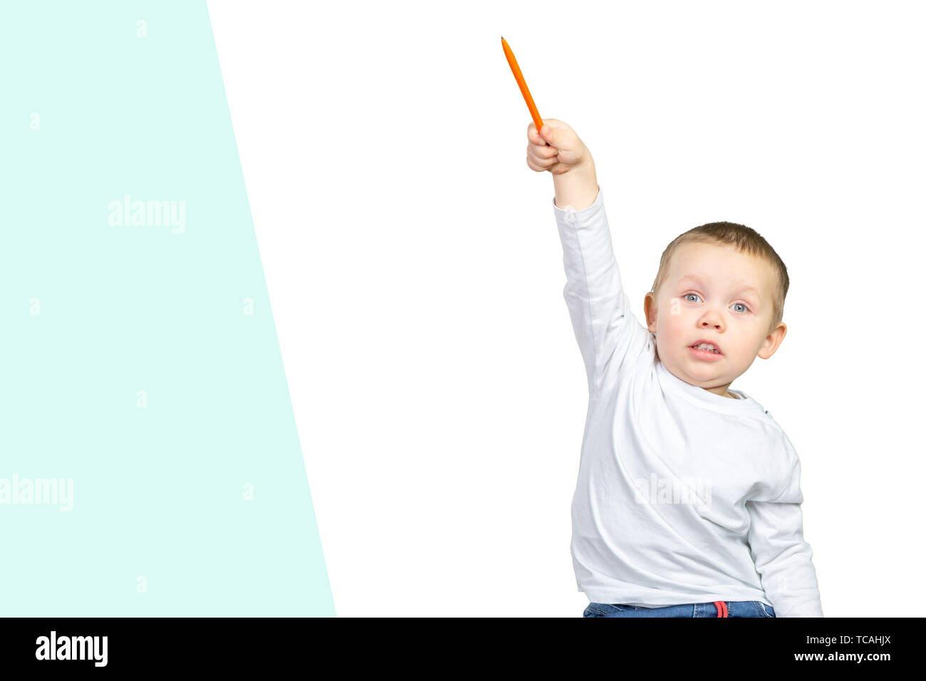 Cheerful little boy pointing up Stock Photo - Alamy