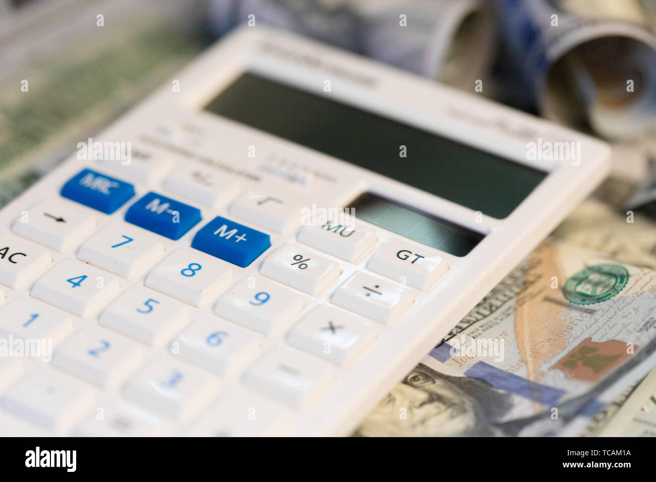 calculator and money Stock Photo - Alamy
