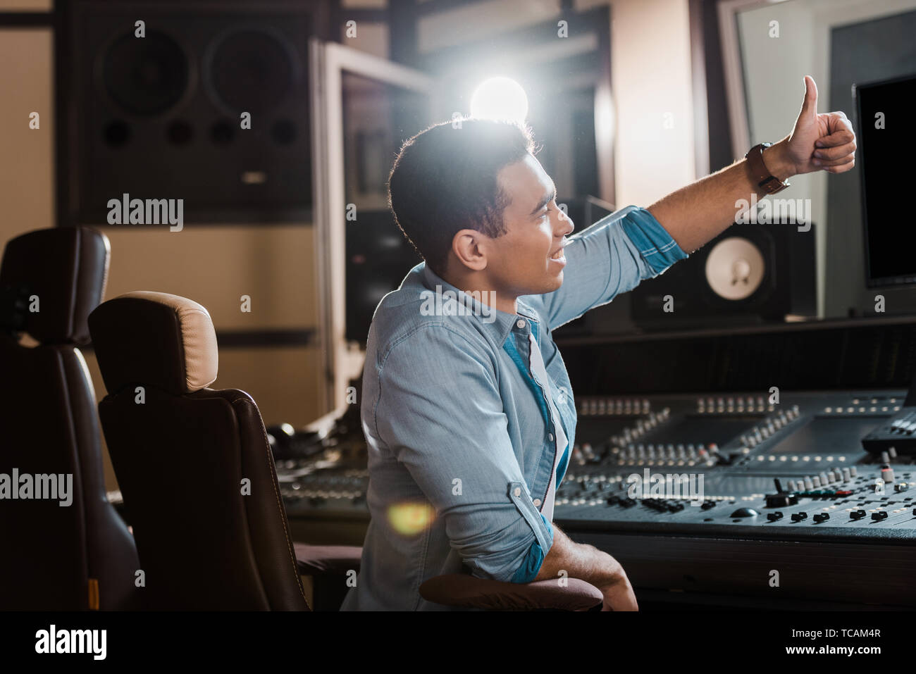 Sound producer showing thumb hi-res stock photography and images - Alamy