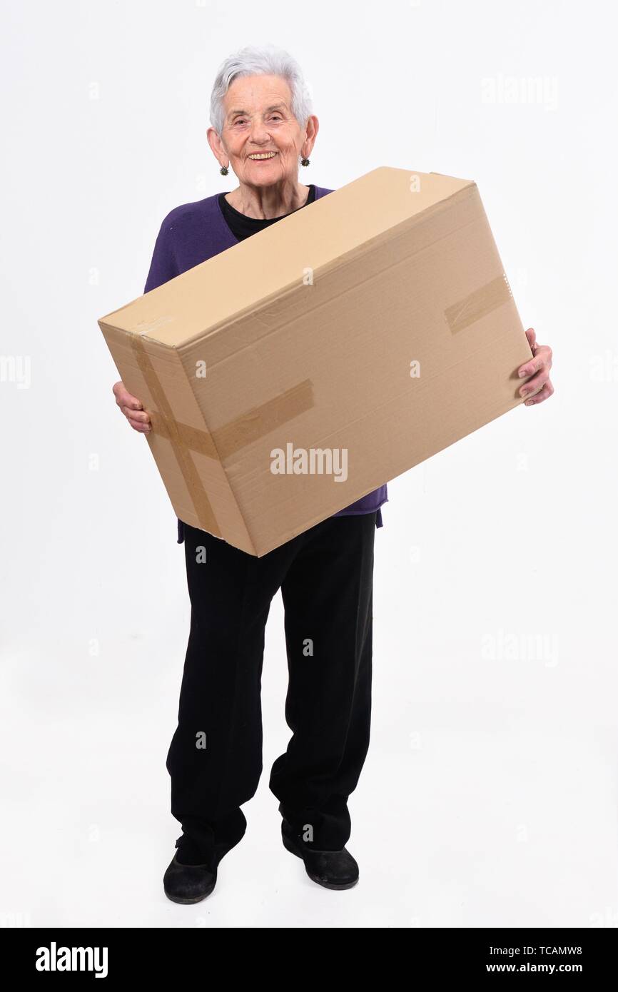 senior woman with package on white background Stock Photo - Alamy
