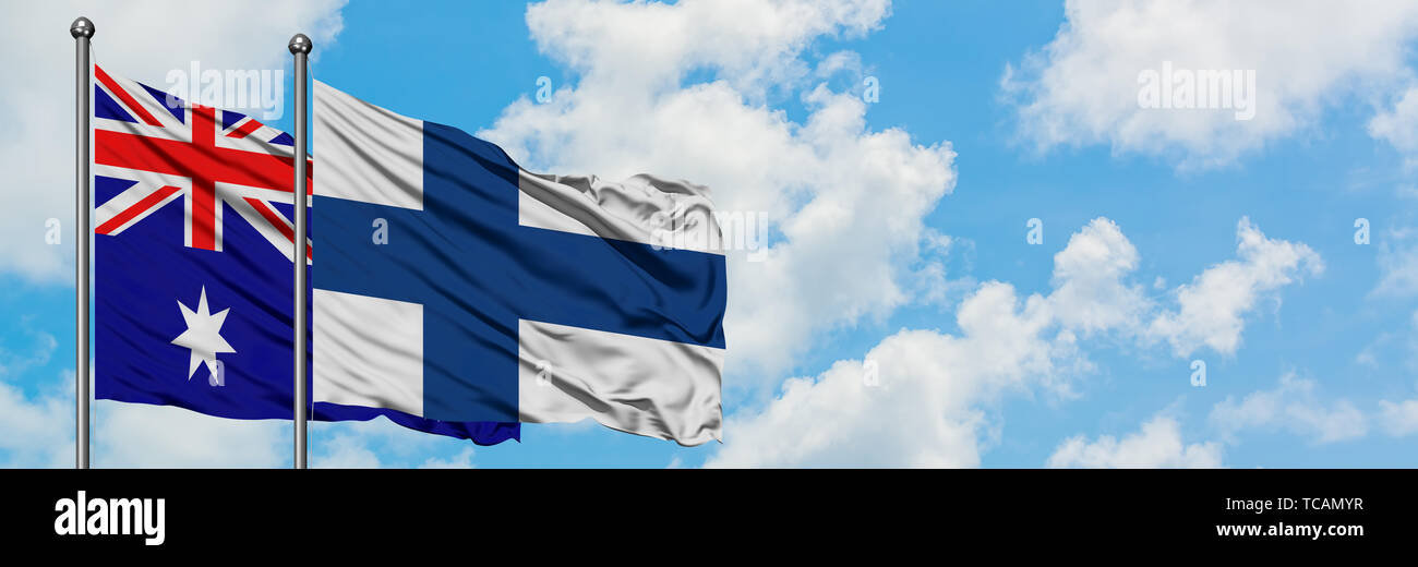 Australia and Finland flag waving in the wind against white cloudy blue ...