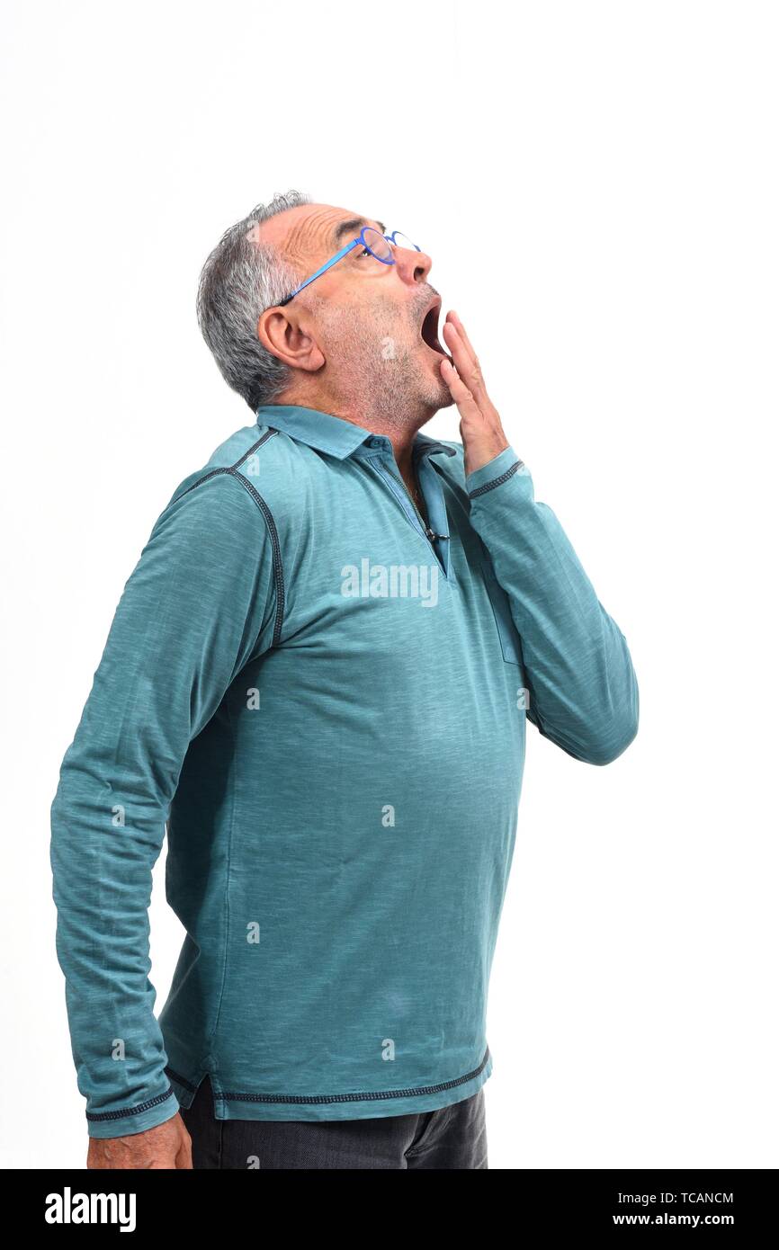 man yawning on white background Stock Photo - Alamy
