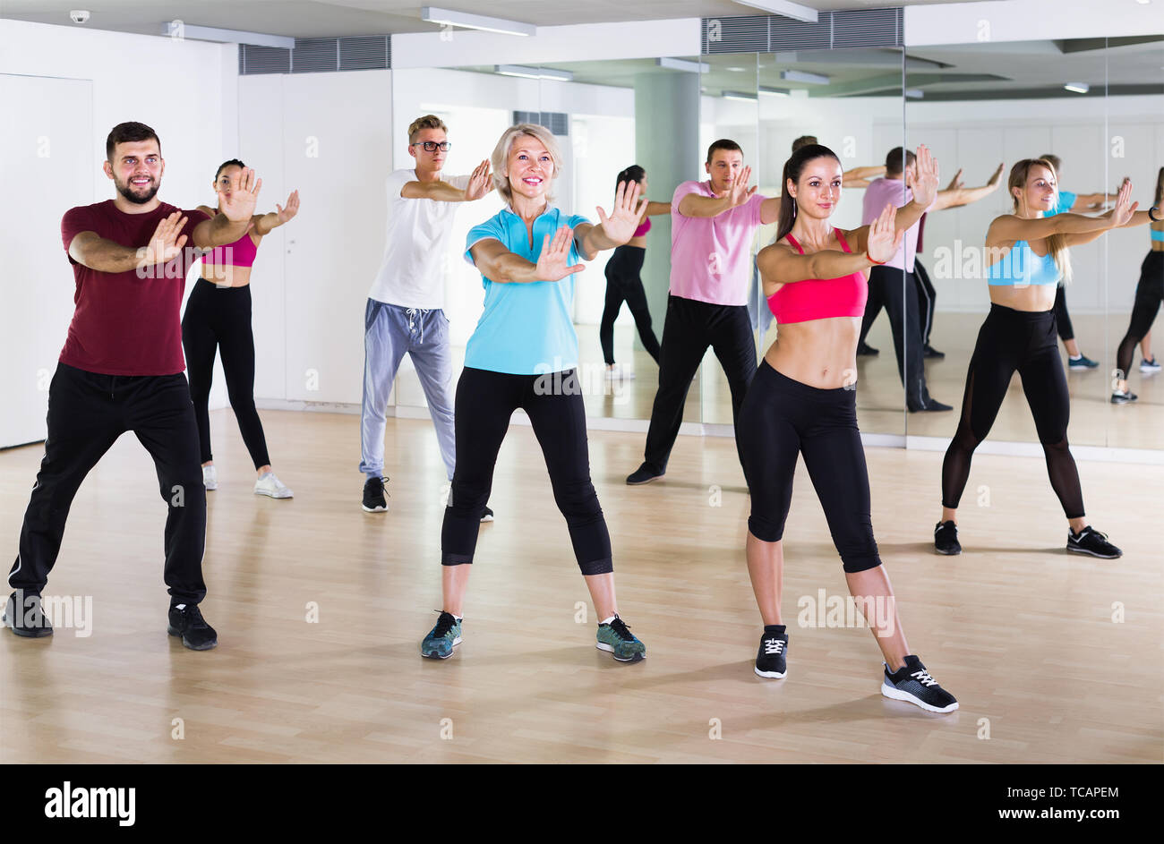 cheerful people dancing aerobics at lesson in the dance class Stock ...