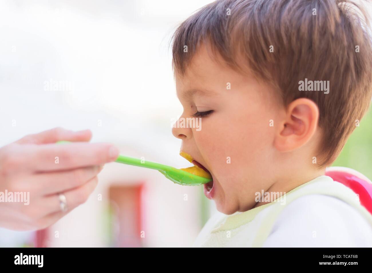 Child smartphone eating hi-res stock photography and images - Alamy