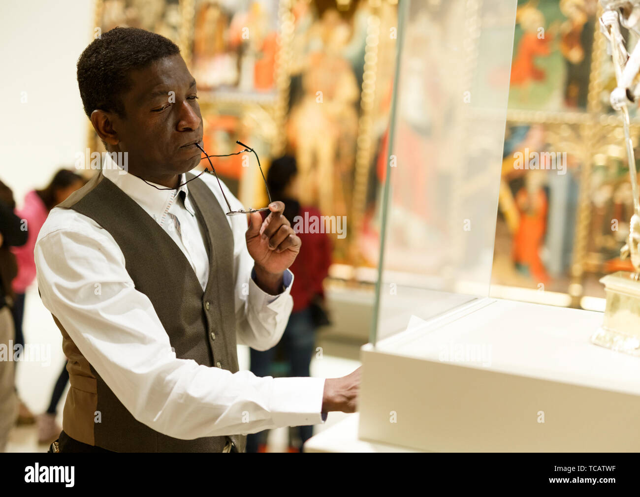 African man looking at exhibit on exposition of historical museum Stock ...