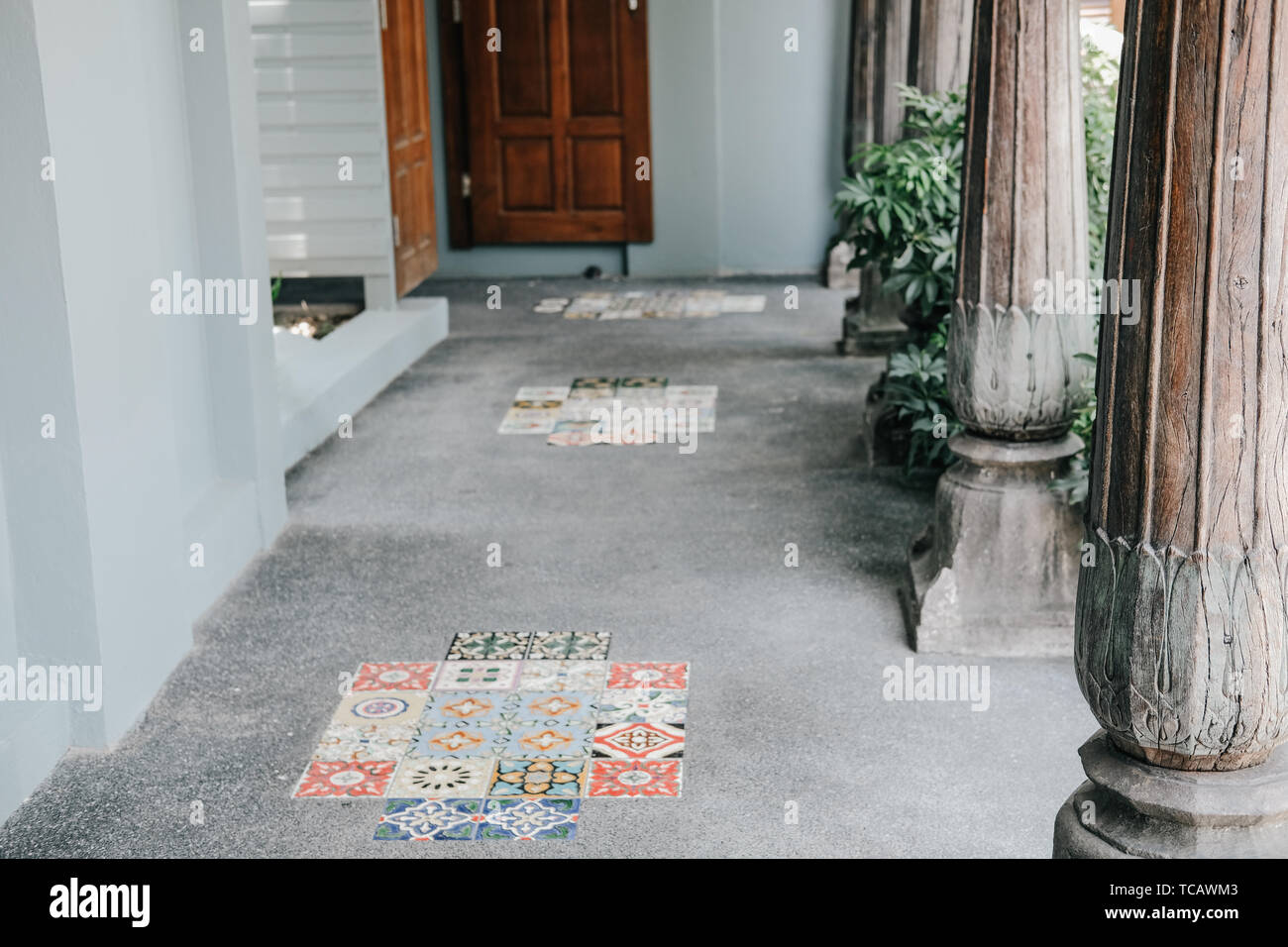 wooden pillar along walkway pathway in building Stock Photo - Alamy