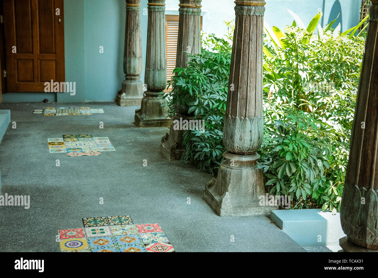 wooden pillar along walkway pathway in building Stock Photo - Alamy