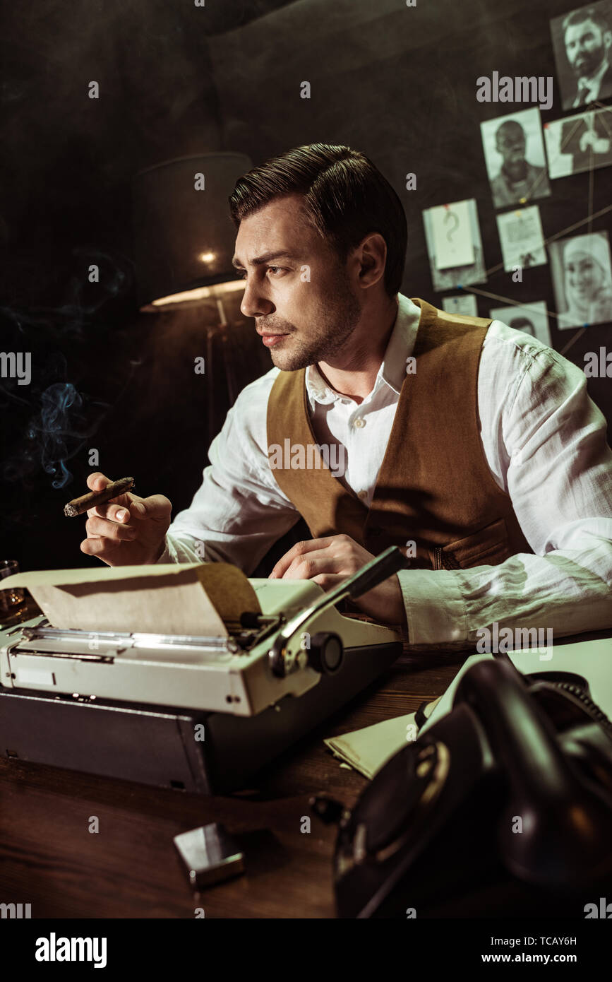 Detective holding cigar while using typewriter in dark office Stock ...