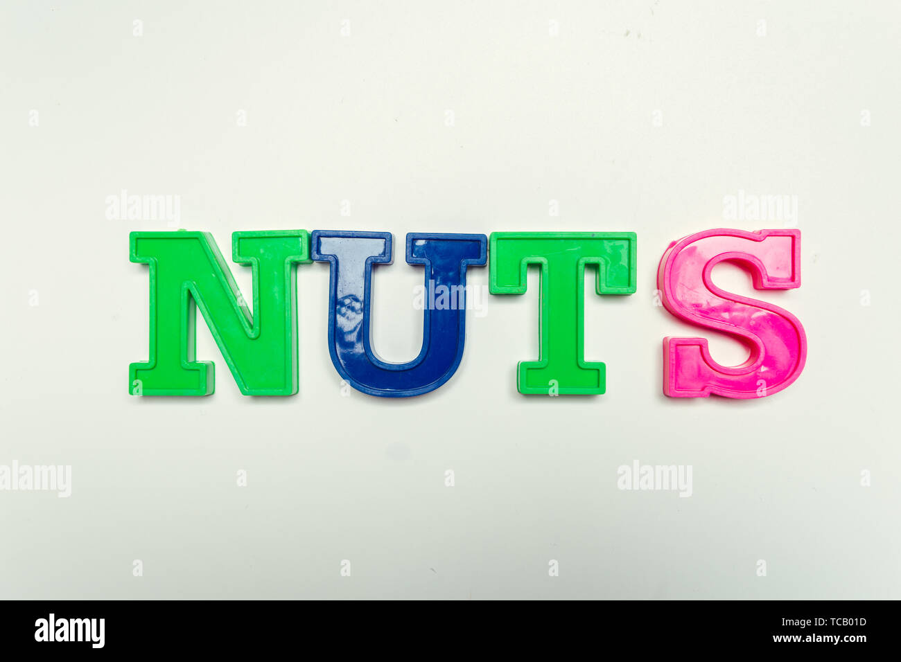 Nuts the word nuts spelled with colorful plastic letters Stock Photo ...