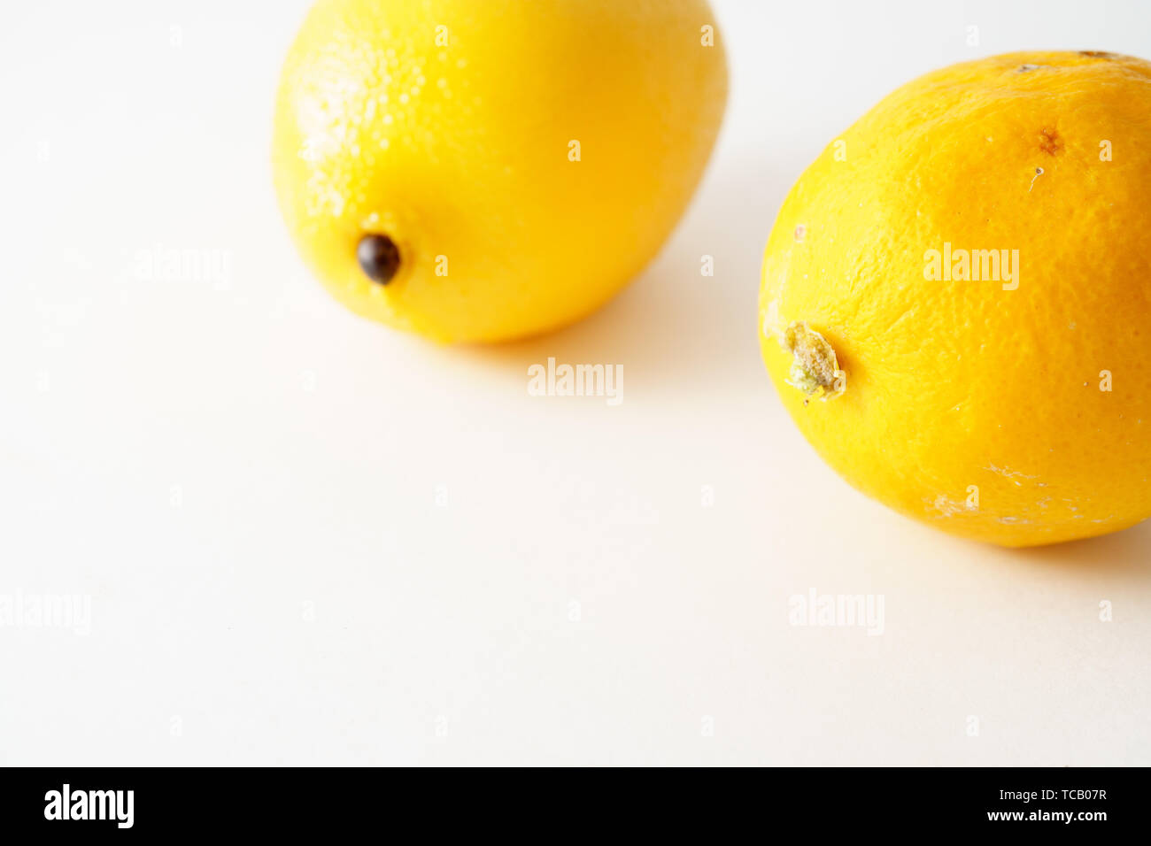 two yellow lemons Stock Photo - Alamy