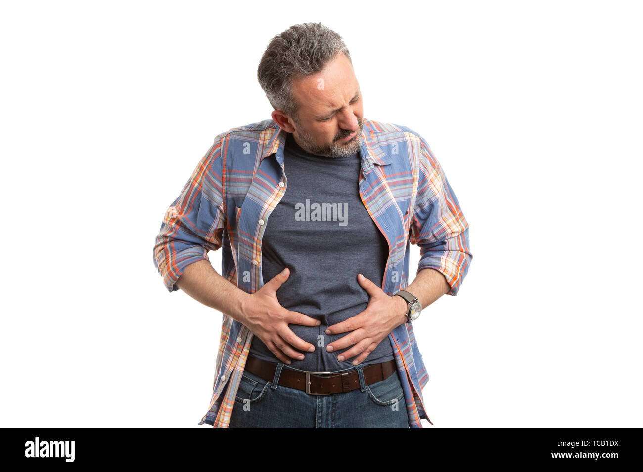 Bloated man touching painful abdomen as stomach health issue concept ...