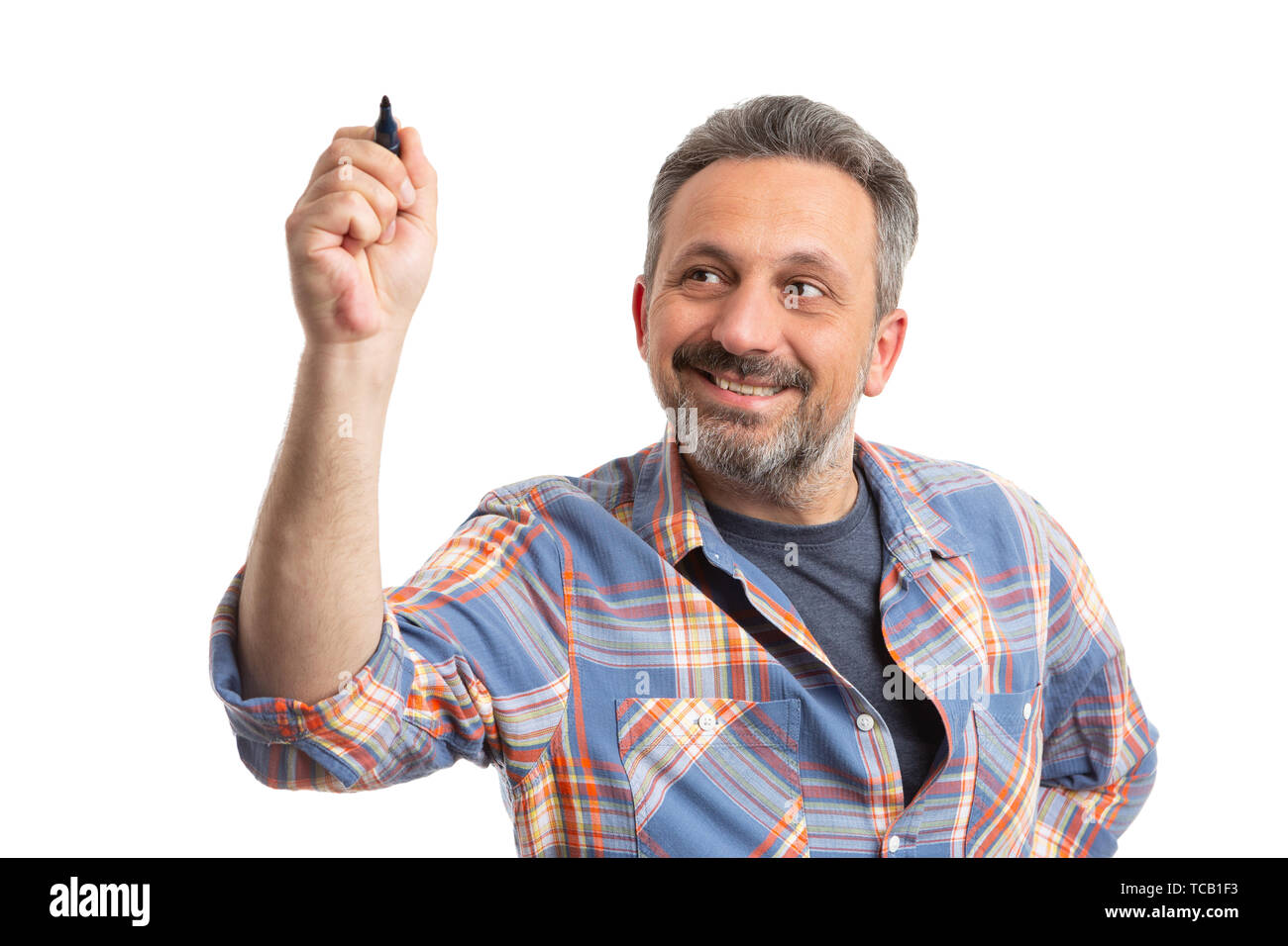 Friendly man writing on transparent glass display as blank copyspace ...