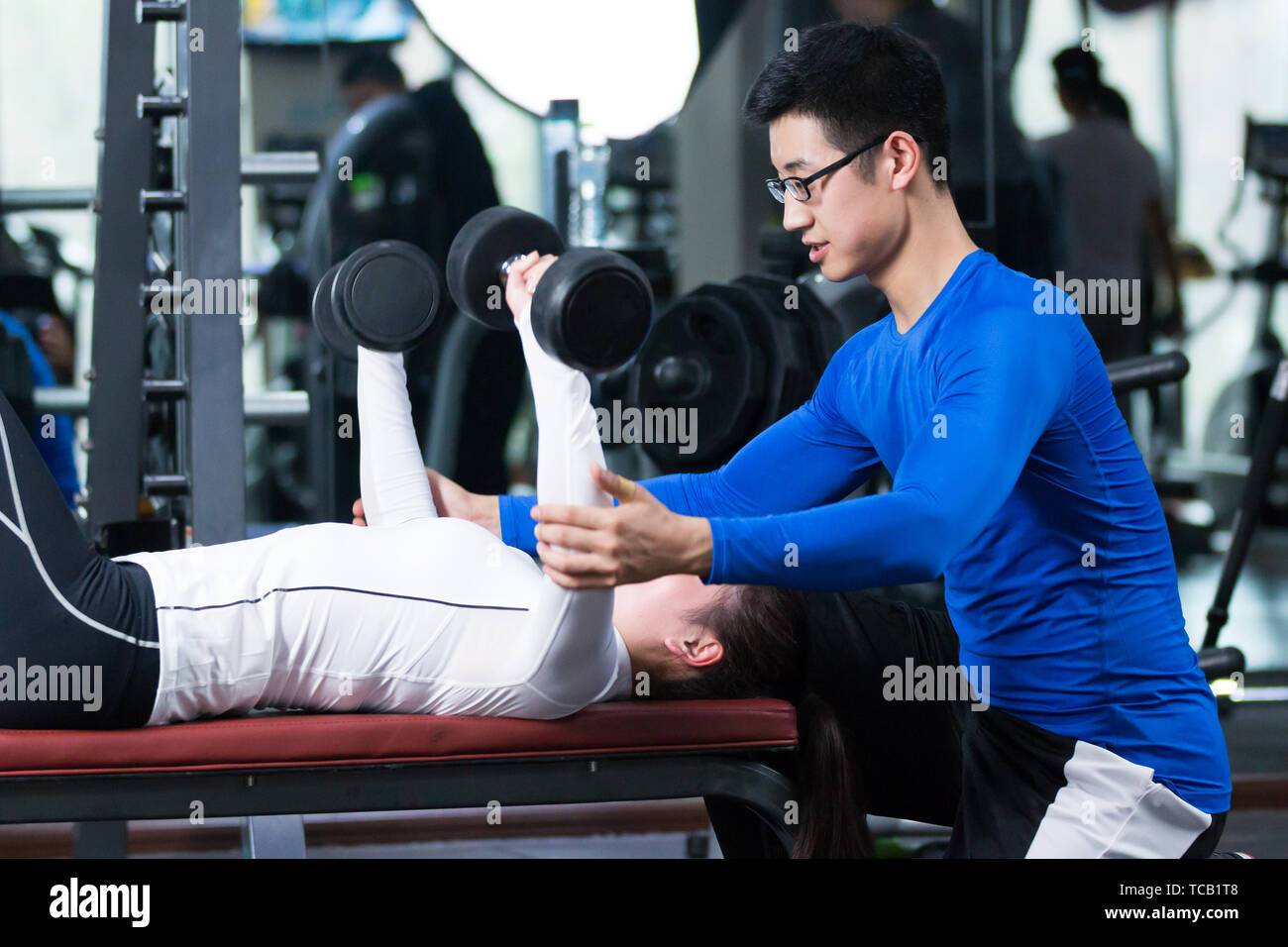young asian people working out in modern gym Stock Photo - Alamy