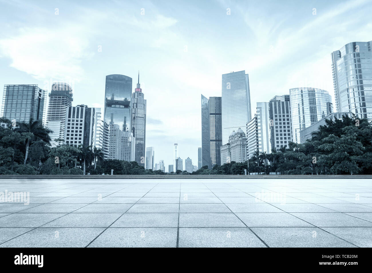 modern square and skyscrapers under cloudy sky Stock Photo - Alamy
