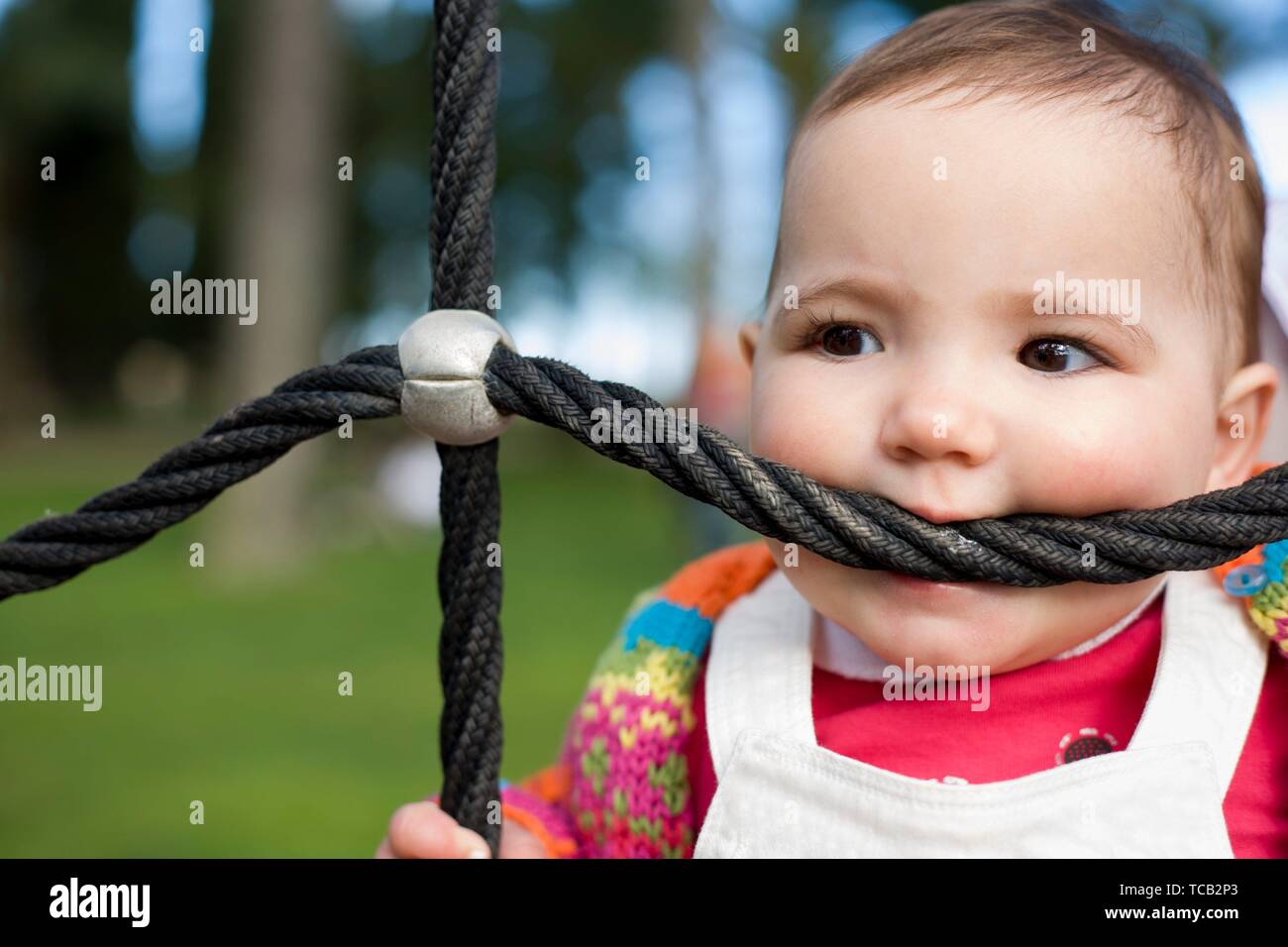 11 month baby girl bitting playground rope as it was a teether. Biting ...