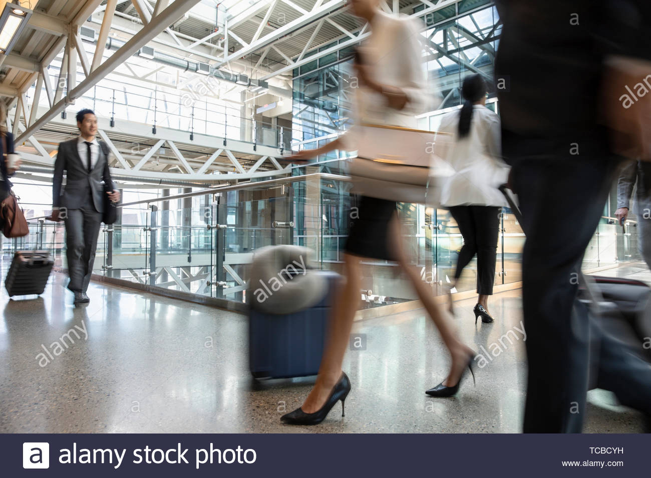 Person pulling suitcases hi-res stock photography and images - Alamy