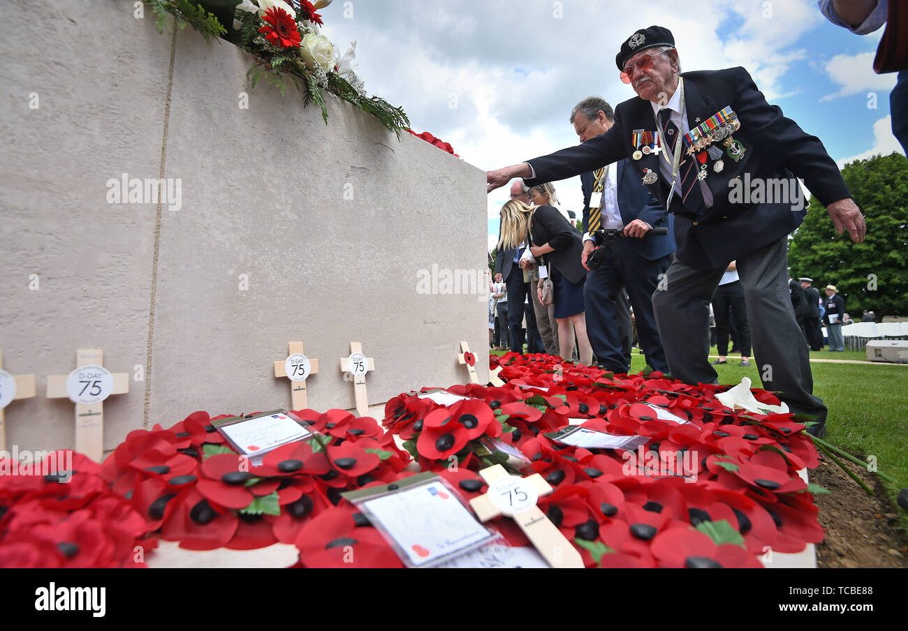 A veteran looks at wreaths at Bayeaux Cathedral to the Commonwealth War ...