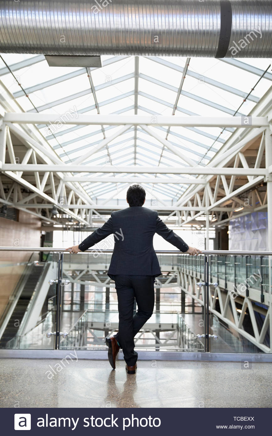 Businessman leaning balcony railing hi-res stock photography and images ...