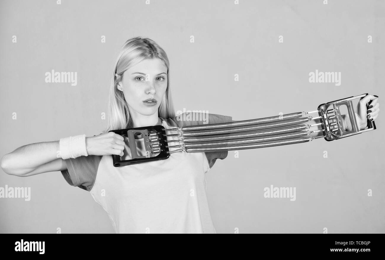 Woman exercising chest expander hi-res stock photography and images - Alamy