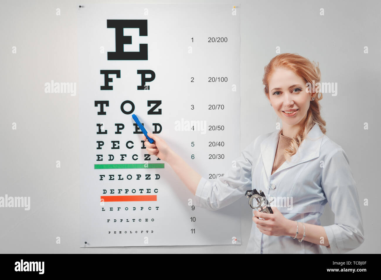 Optical. Doctor - ophthalmologist shows eyesight test Stock Photo - Alamy