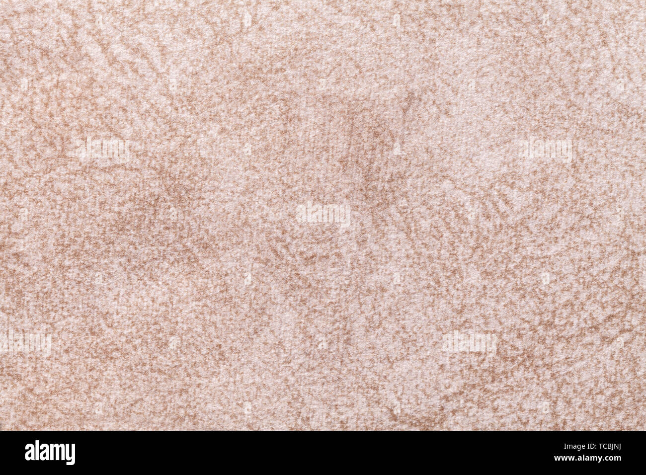 Light beige fluffy background of soft, fleecy cloth. Texture of textile ...