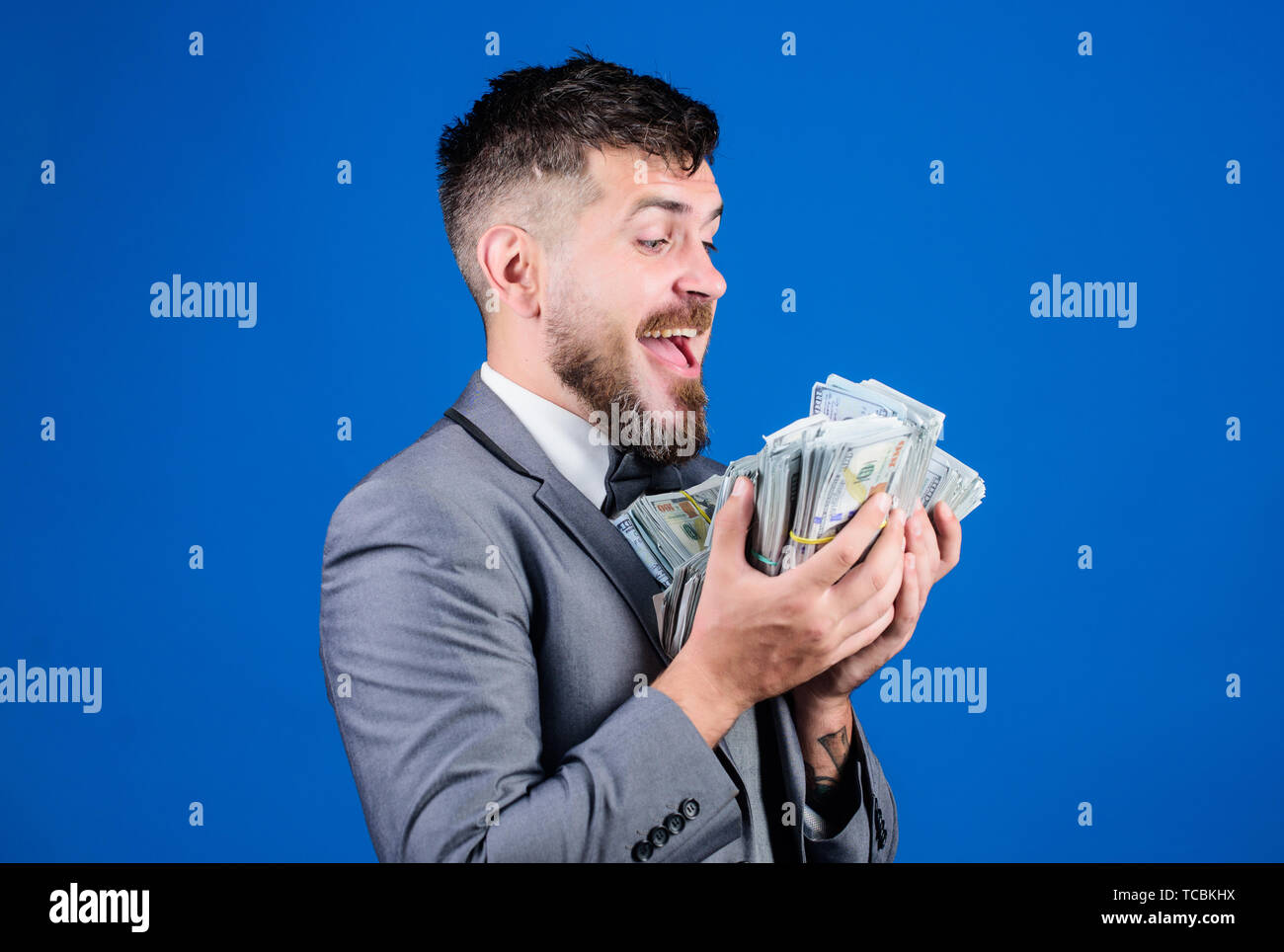 Businessman got cash money. Gain real money. Richness and wellbeing ...