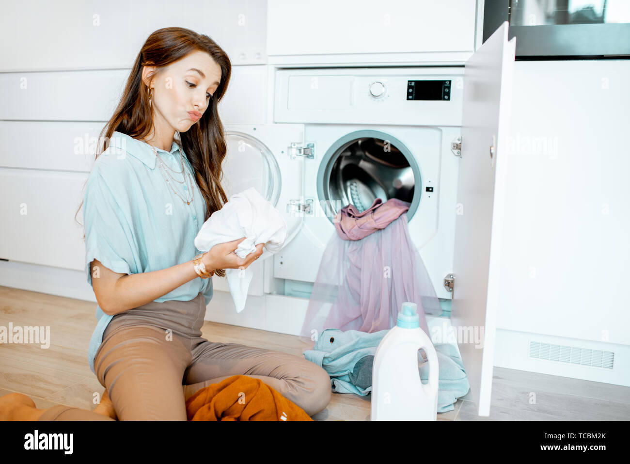 Woman sorting her clothes hi-res stock photography and images - Alamy