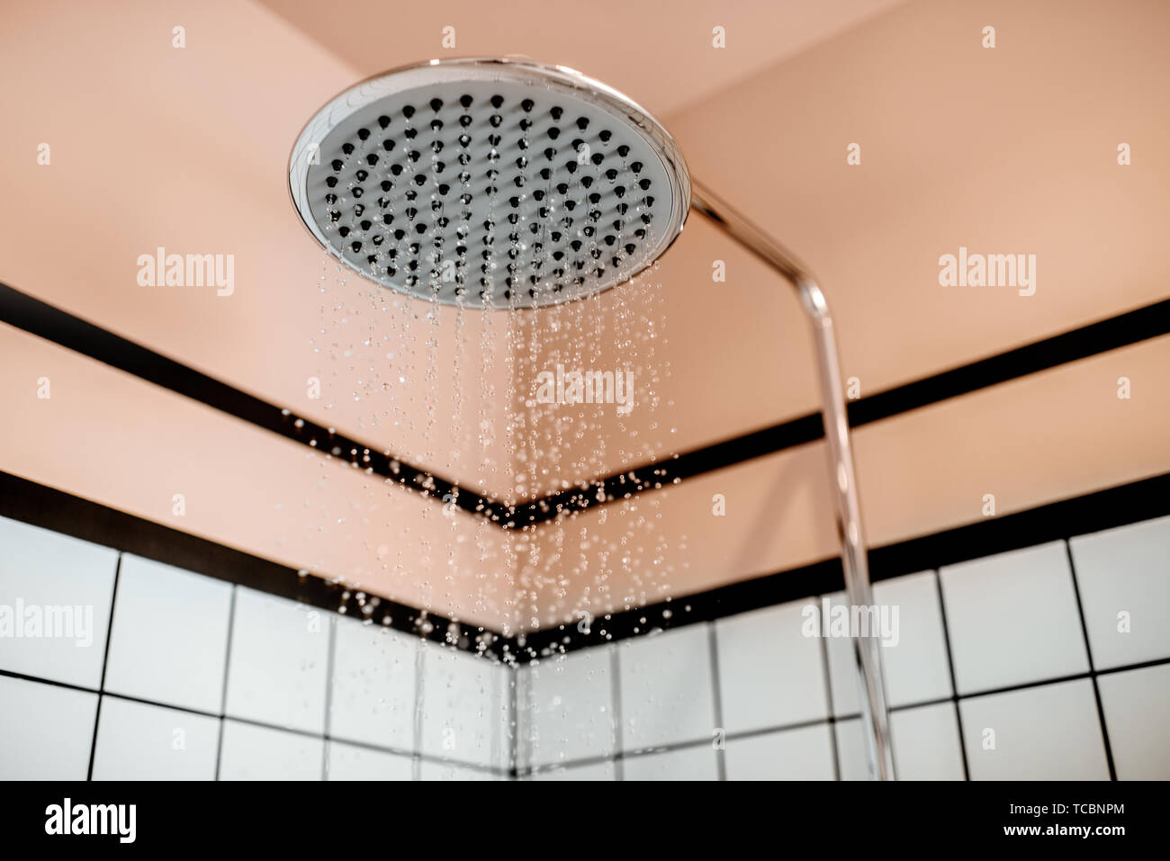 Shower with falling drops of water in the bathroom Stock Photo - Alamy