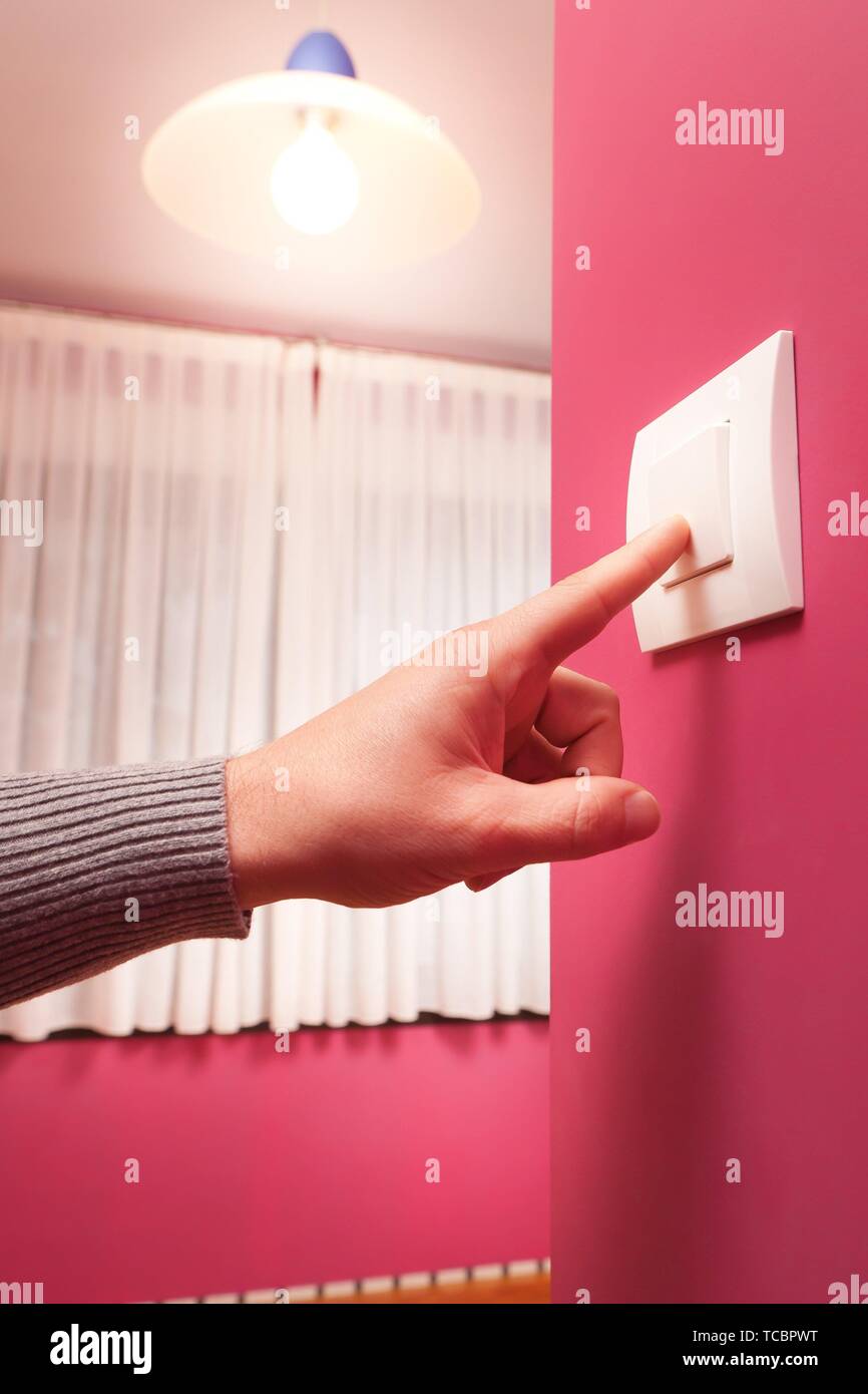 Hand on switch hi-res stock photography and images - Alamy