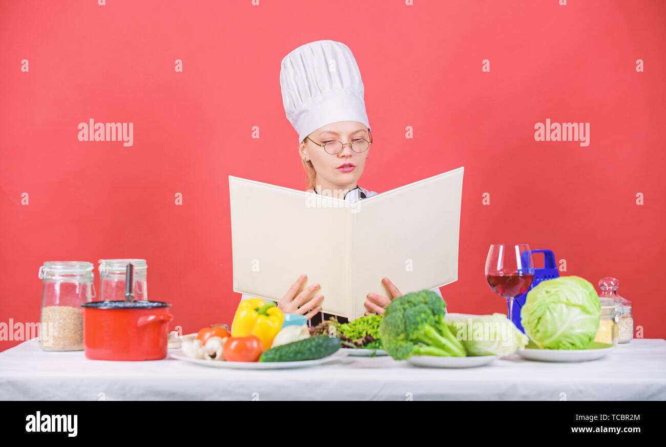 Culinary school concept. Female in hat and apron knows everything about ...