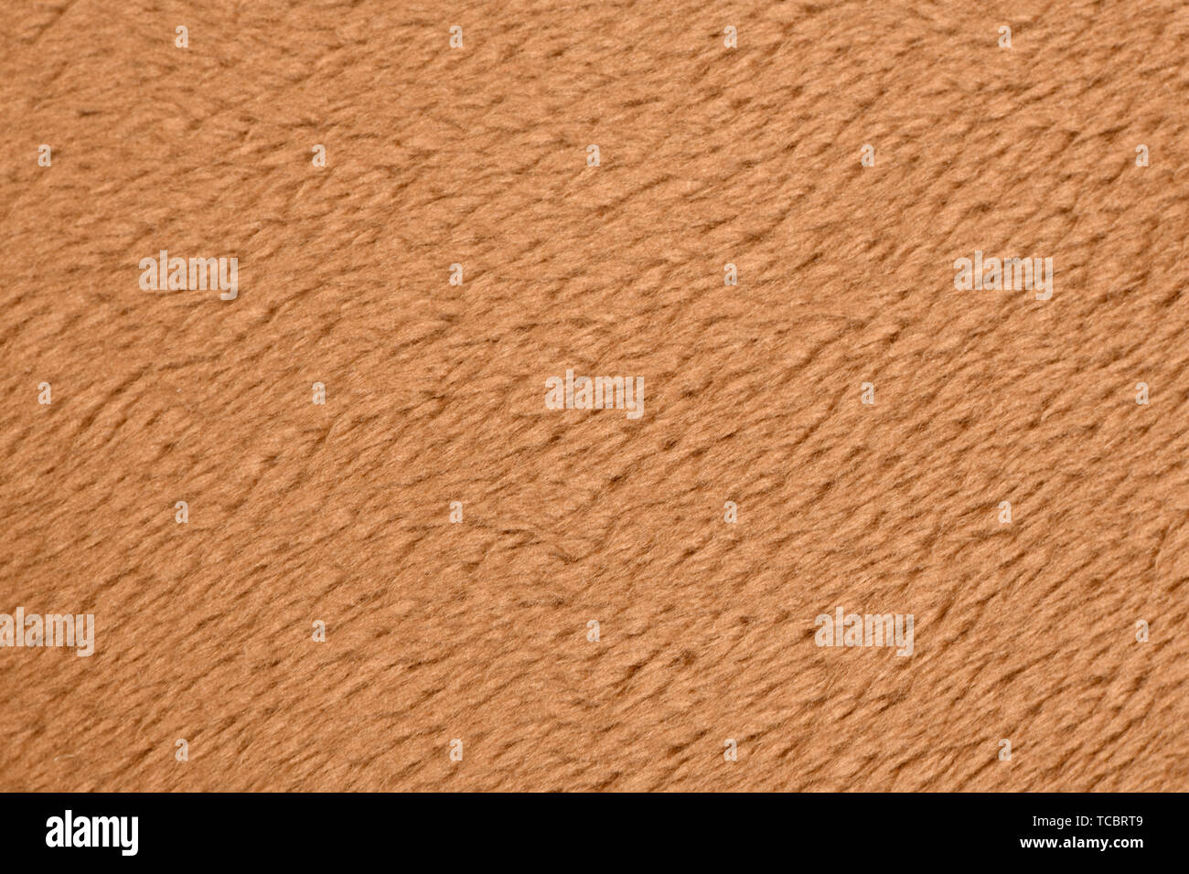 Texture of light brown wool textile material closeup. Green abstract ...