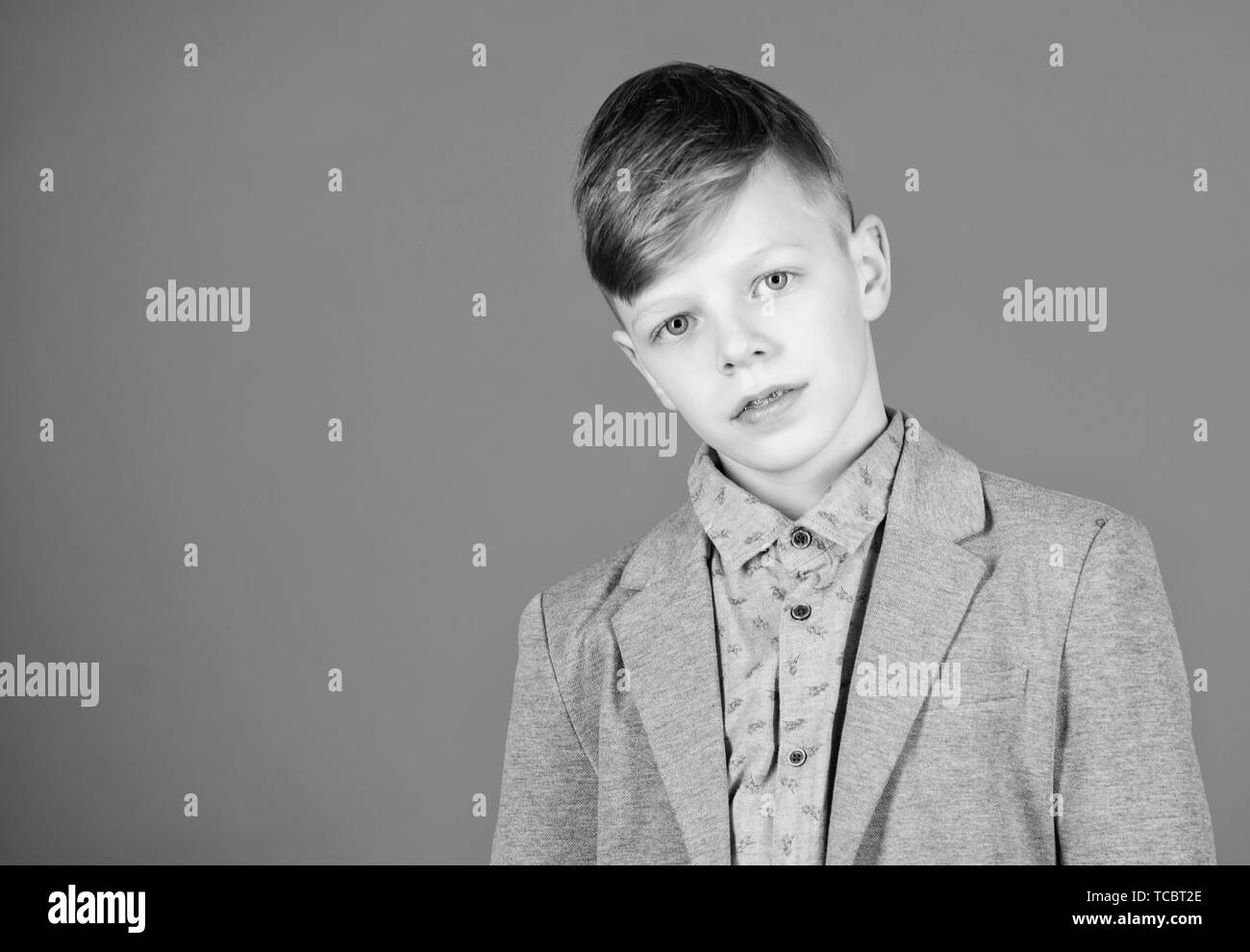 Trendy kid. Adorable fashion model. Fashion little boy with serious ...