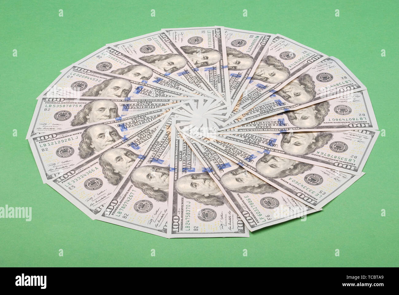Money in the shape of a circle isolated on green background Stock Photo ...