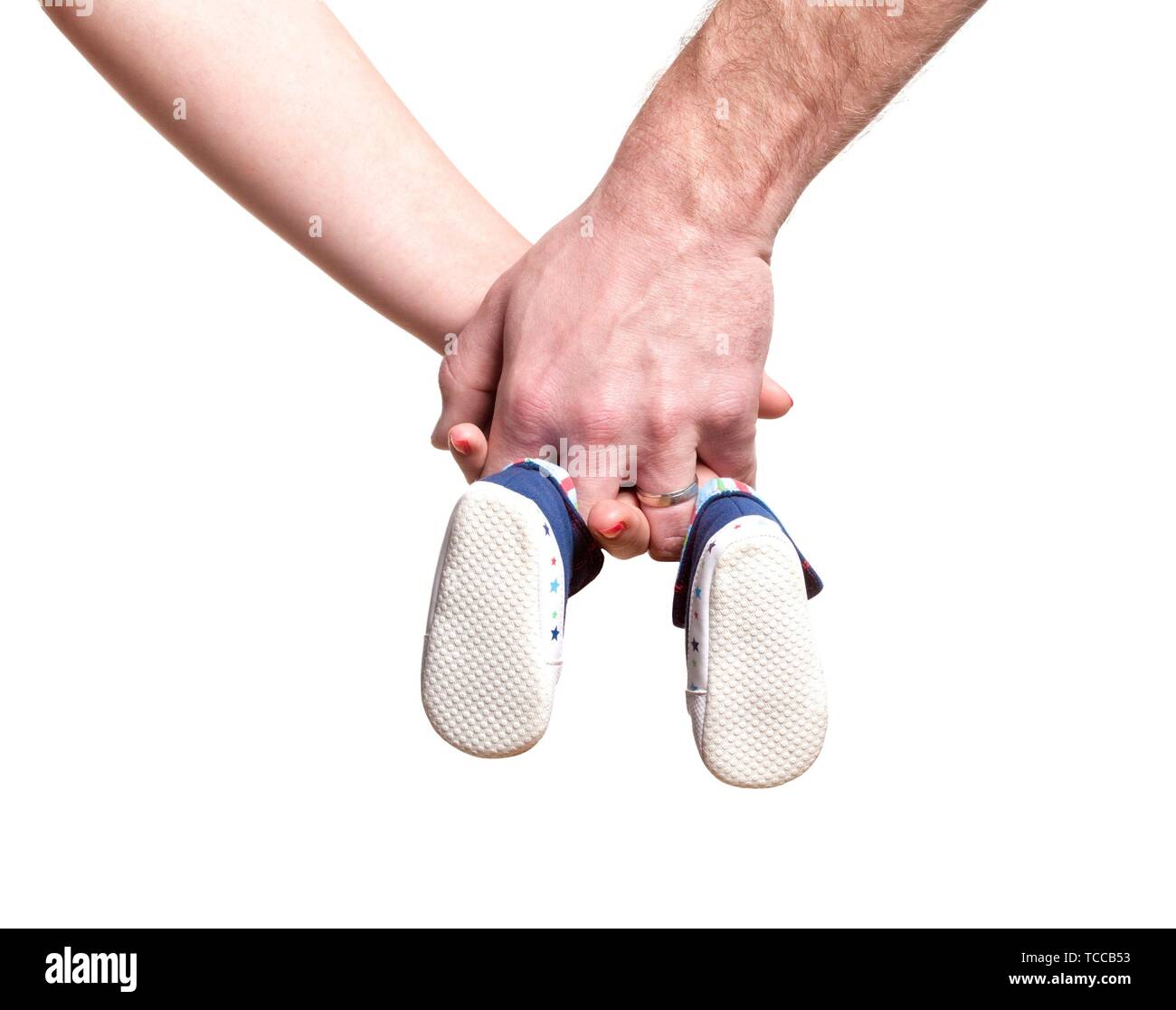Hand holding shoes hi-res stock photography and images - Alamy
