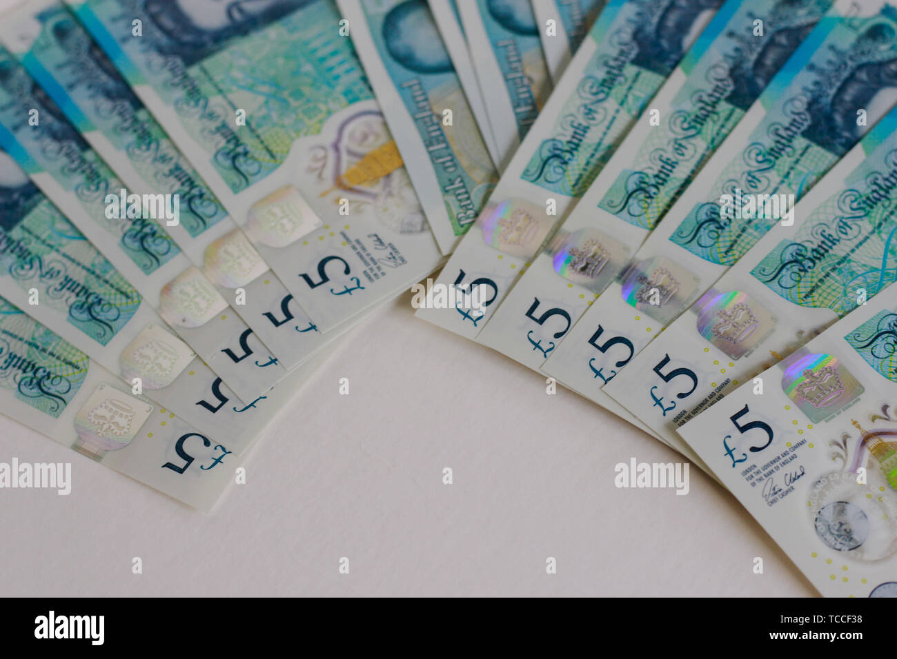 Five pound banknotes on a white background, Bank of Scotland £5 note, a ...