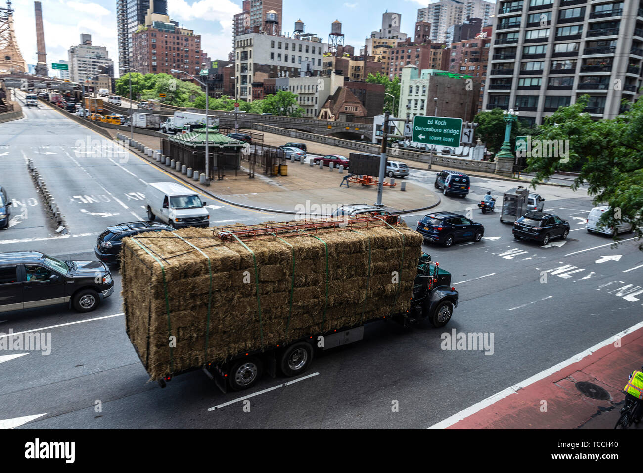 New York City, USA - July 31, 2018: Truck loaded with straw bales ...
