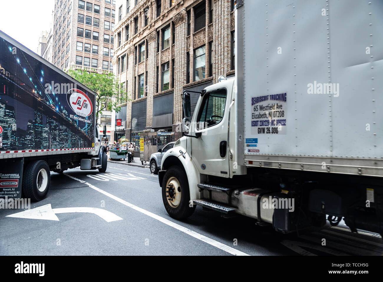 New York City, USA - July 31, 2018: Two heavy trucks with container ...