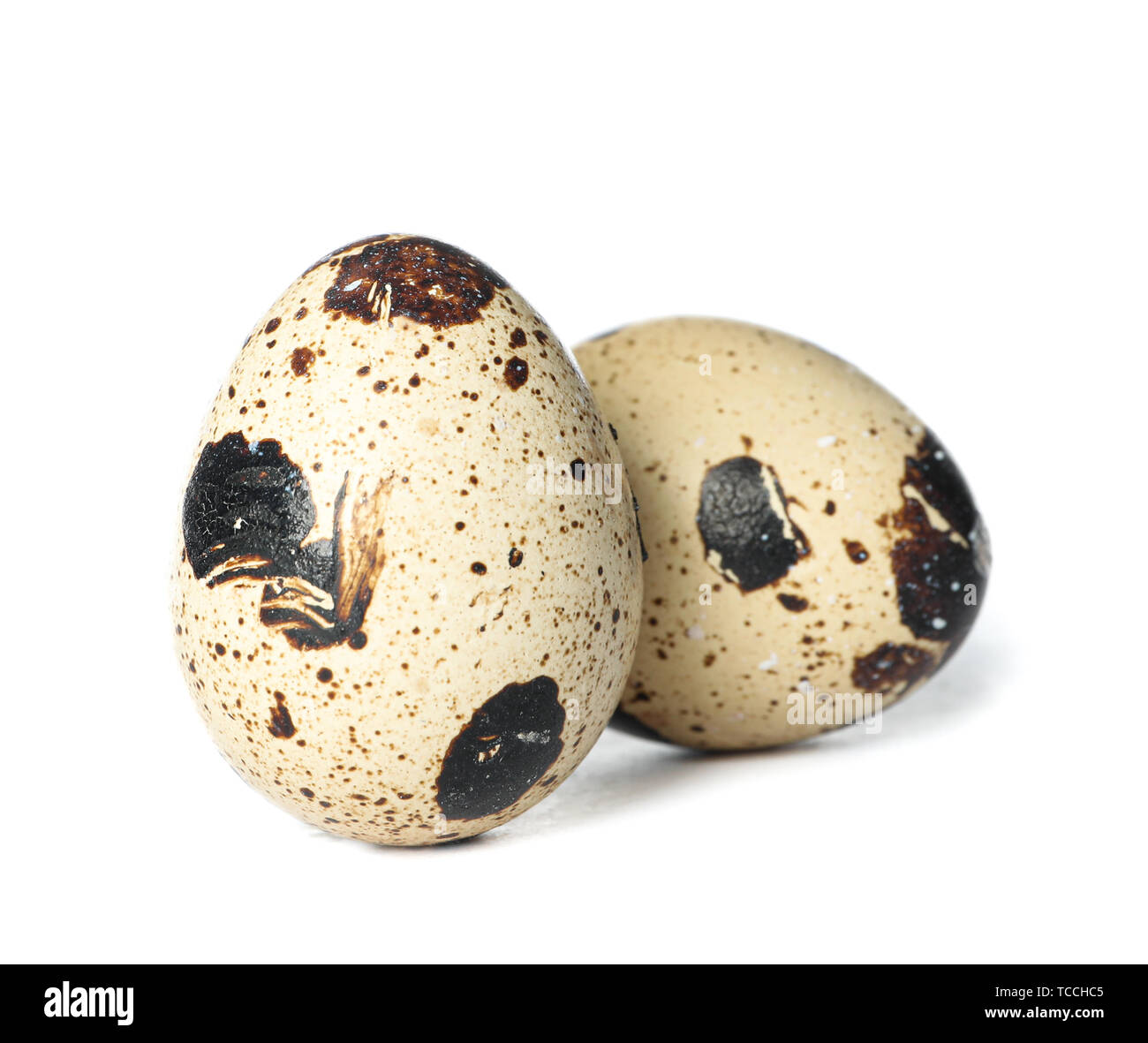 Raw quail eggs isolated on white background Stock Photo - Alamy