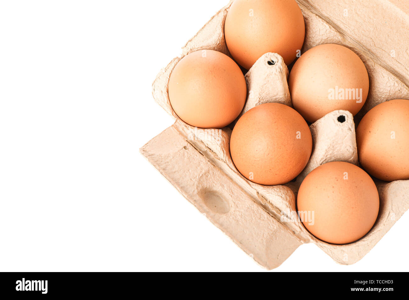 Brown chicken eggs in carton box isolated on white background, top view ...