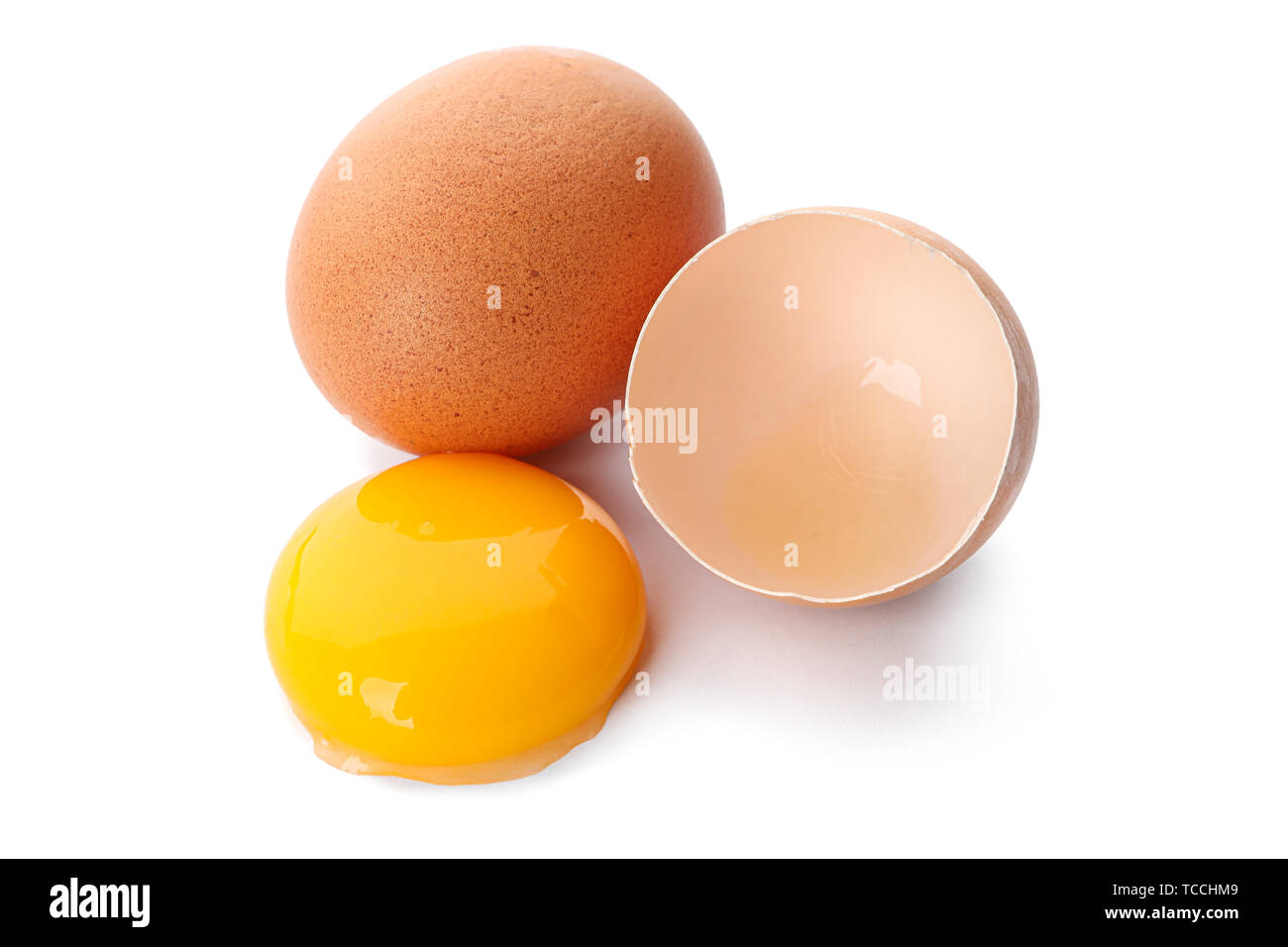 Whole egg, half eggshell and egg yolk isolated on white background ...