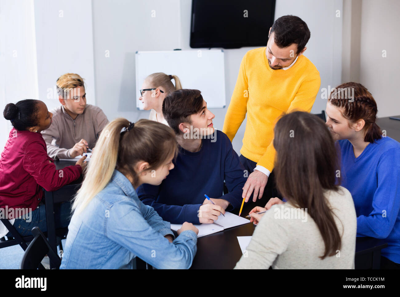 Glad fellow students having group work tasks during school day Stock ...