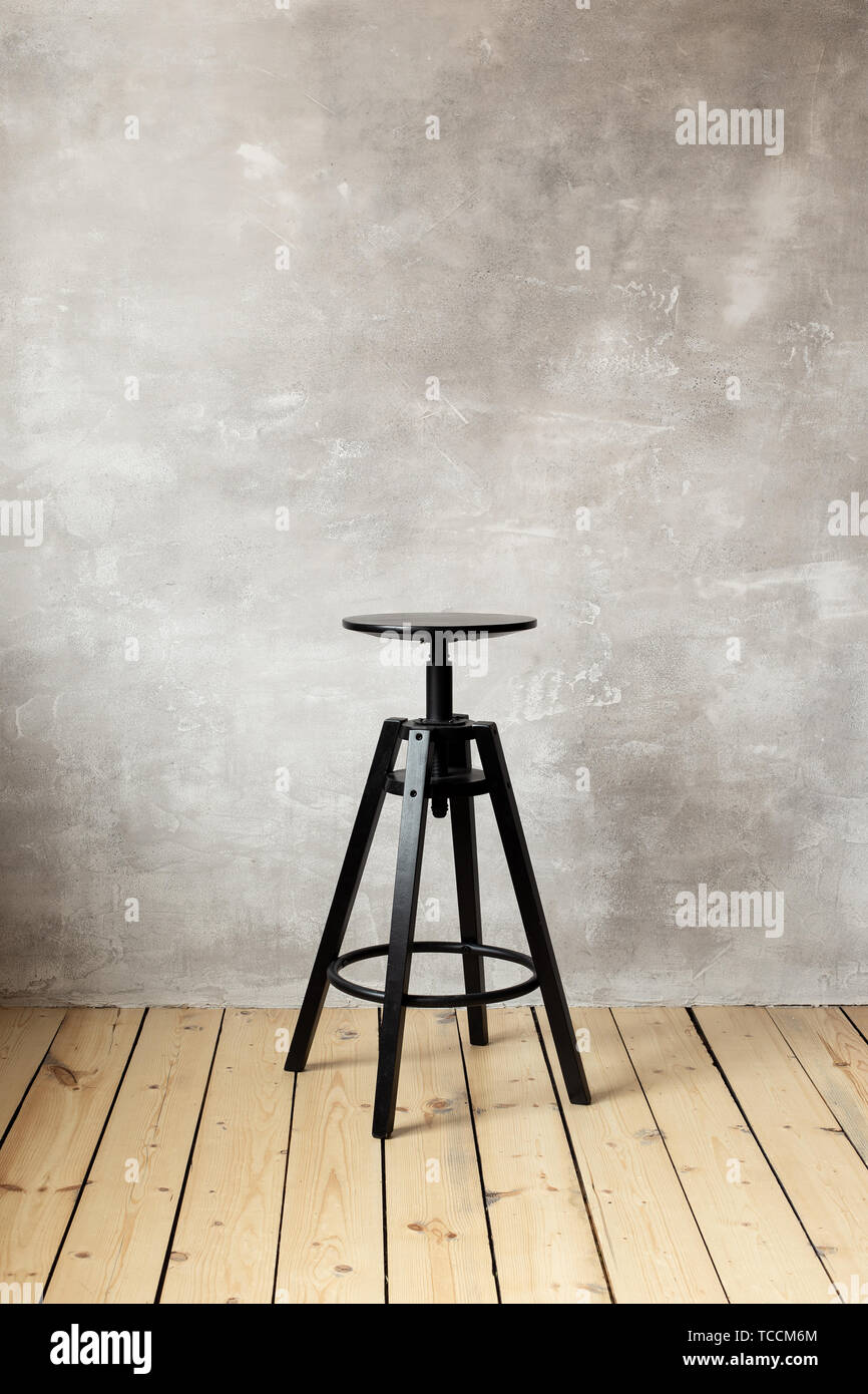 Bar stool on the gray background of the wall. Free space for text Stock ...