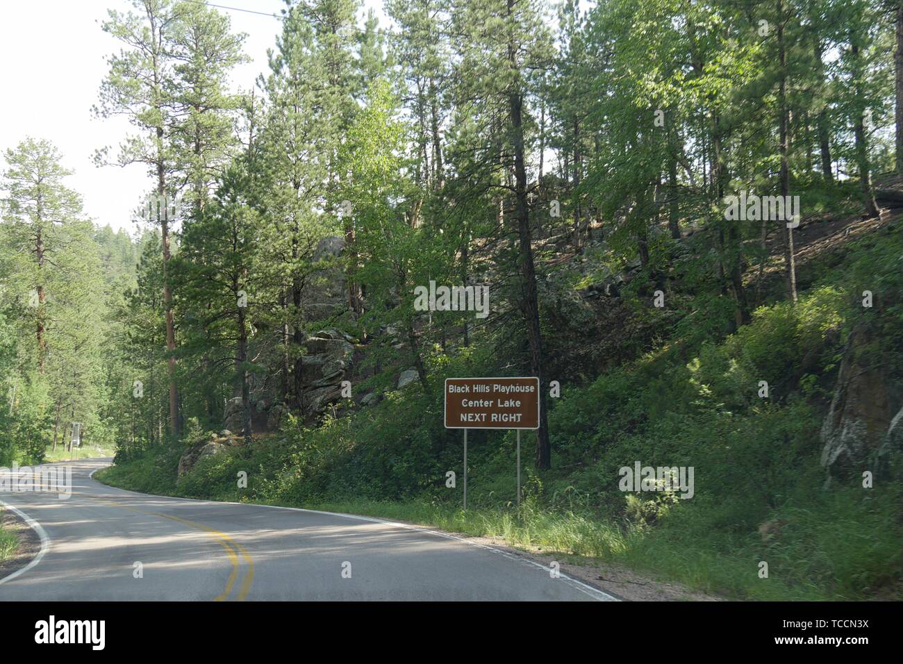 Roadside directional sign for Black hills Playhouse, Center Lake at the ...